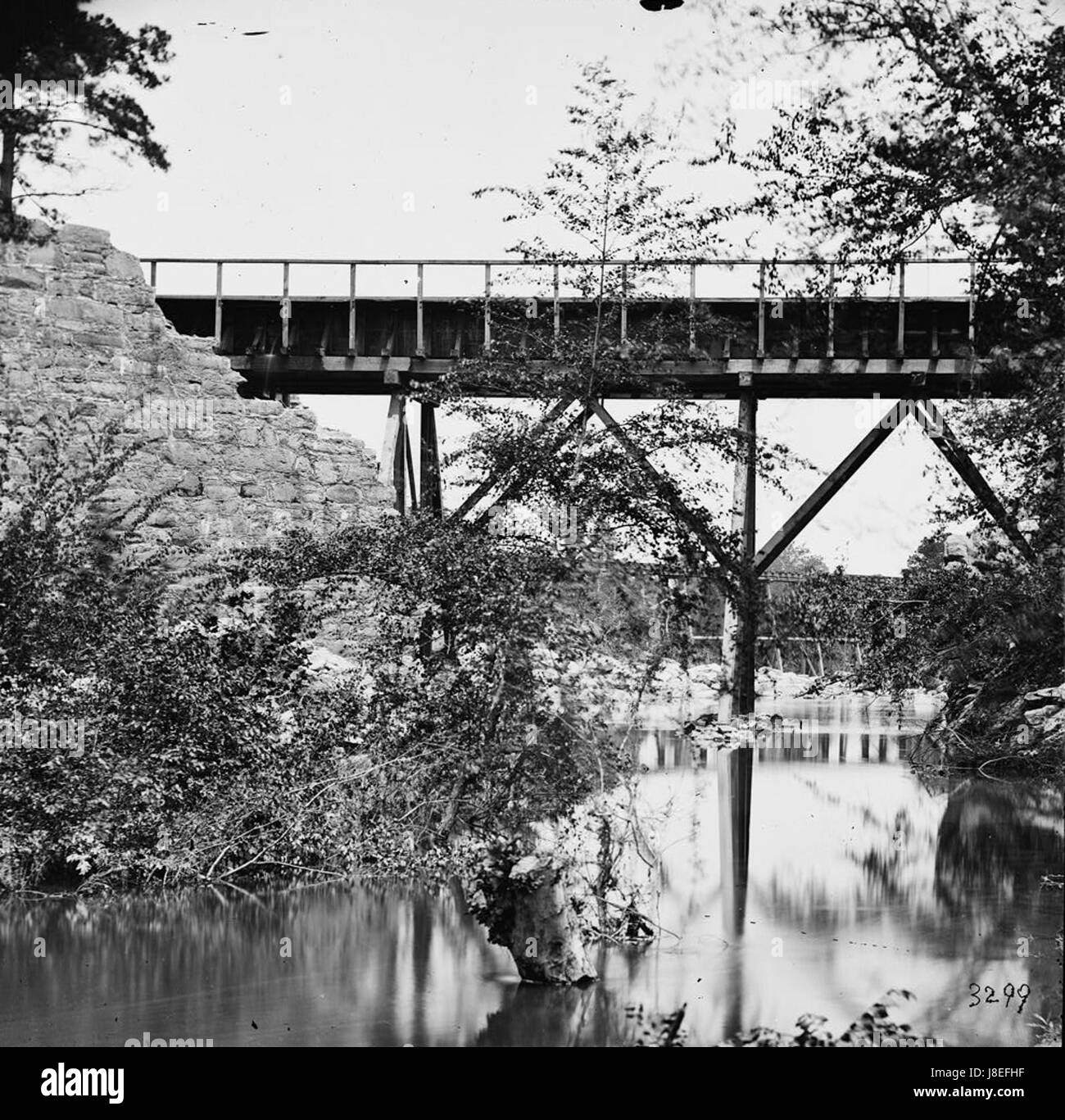 The footbridge across Old Town Creek is a small pedestrian structure ...