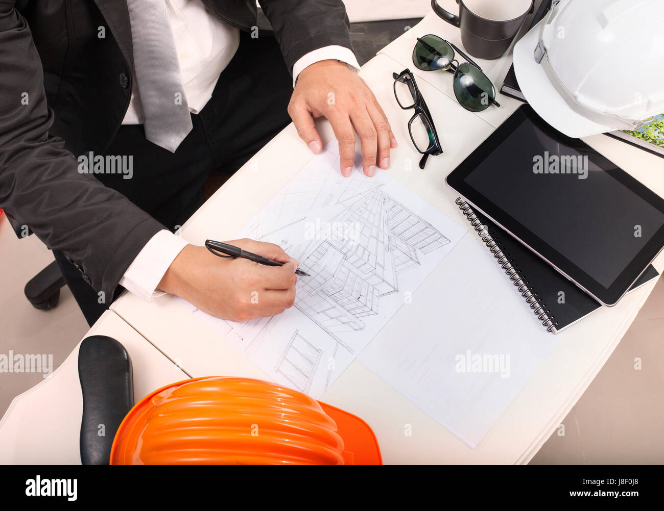 top view of architect working table with drawing perspective building ...