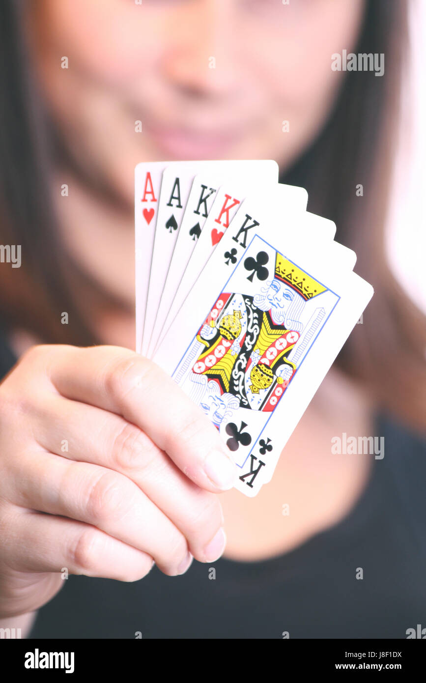 Woman holding cards Stock Photo - Alamy