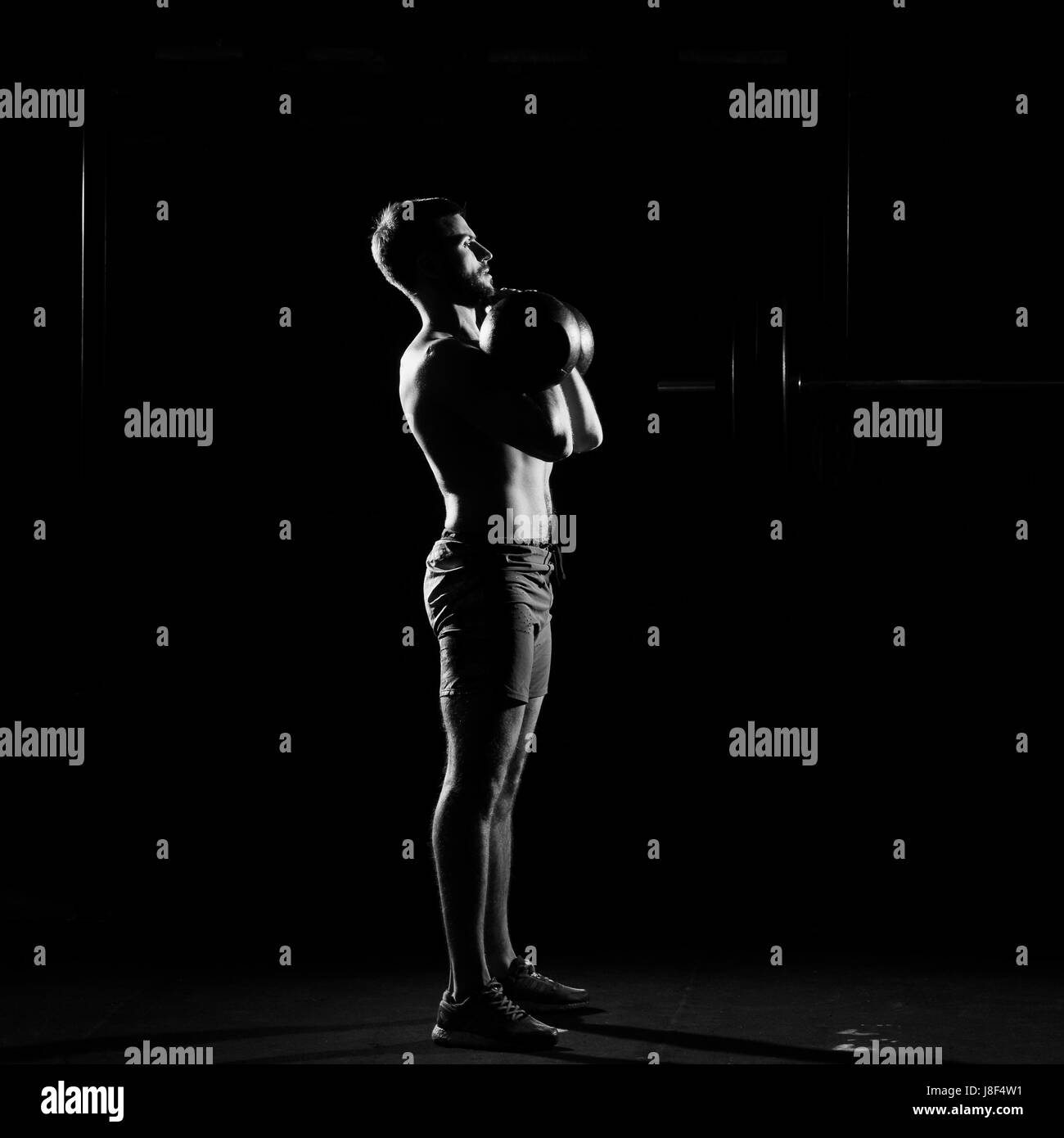 Fitness man doing squat exercise Black and White Stock Photos & Images ...