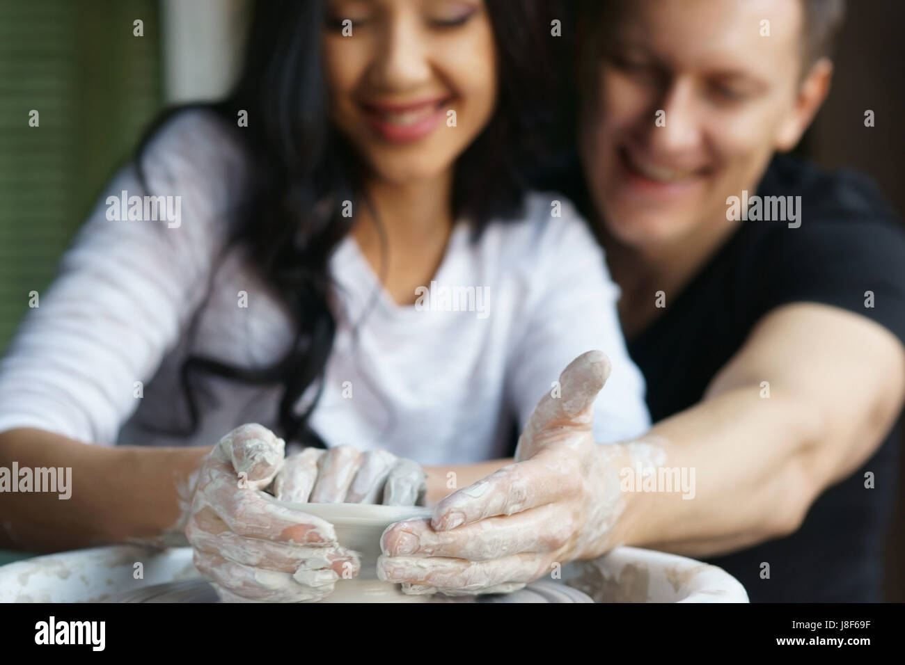 Pottery. Happy jouous romantic caucasian couple working together on ...