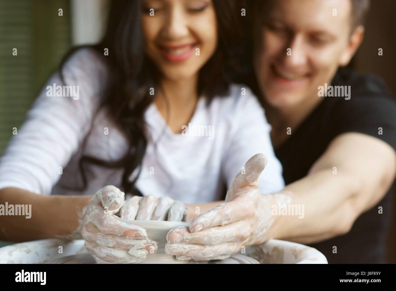 Pottery. Happy joyous romantic caucasian couple working together on ...