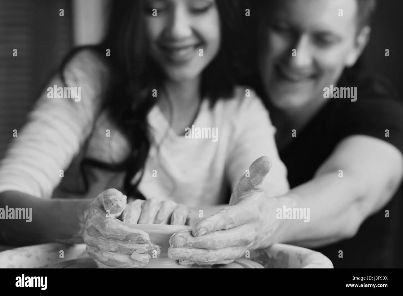 Pottery. Happy joyous romantic caucasian couple working together on ...
