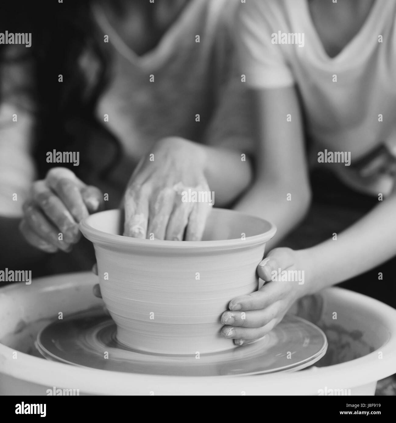 Pottery classes. Young beautiful pretty caucasian brunette mother ...