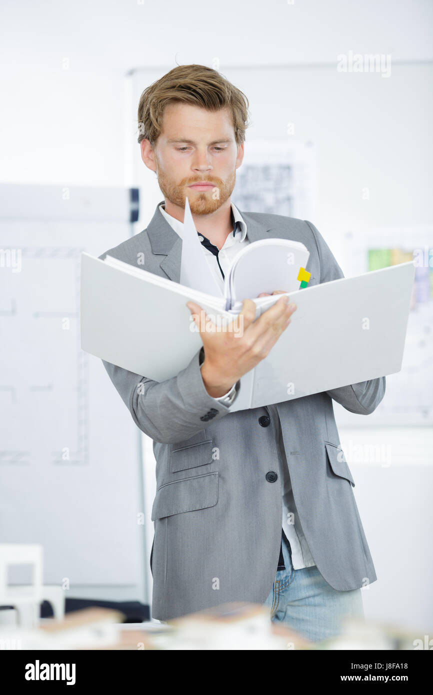 man reading the proposal Stock Photo - Alamy
