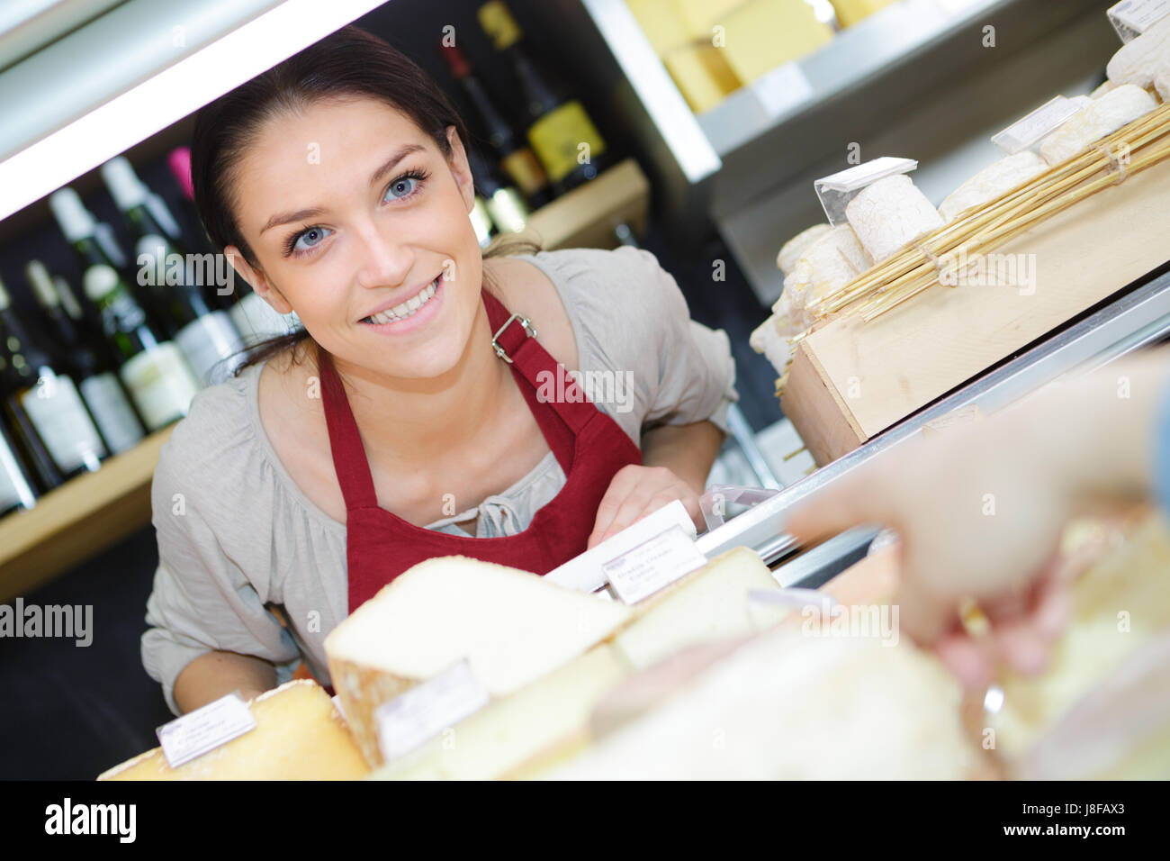 the woman selling cheese Stock Photo - Alamy