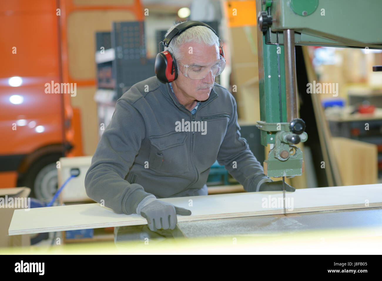 industrial carpenter operating the machine Stock Photo - Alamy