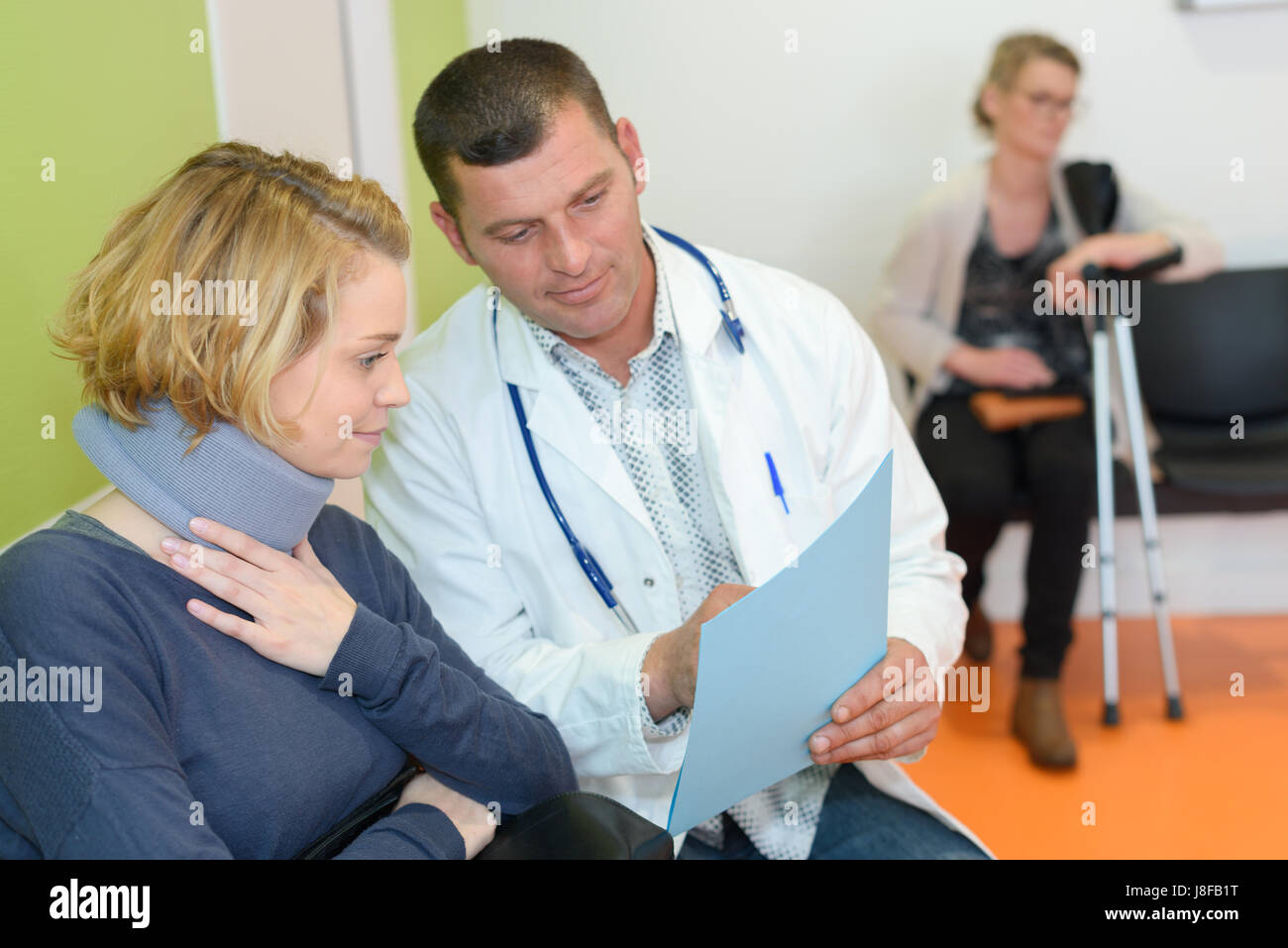 doctor giving a patient a quick report Stock Photo - Alamy