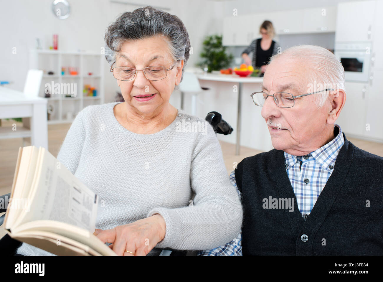 reading a story to the partner Stock Photo - Alamy