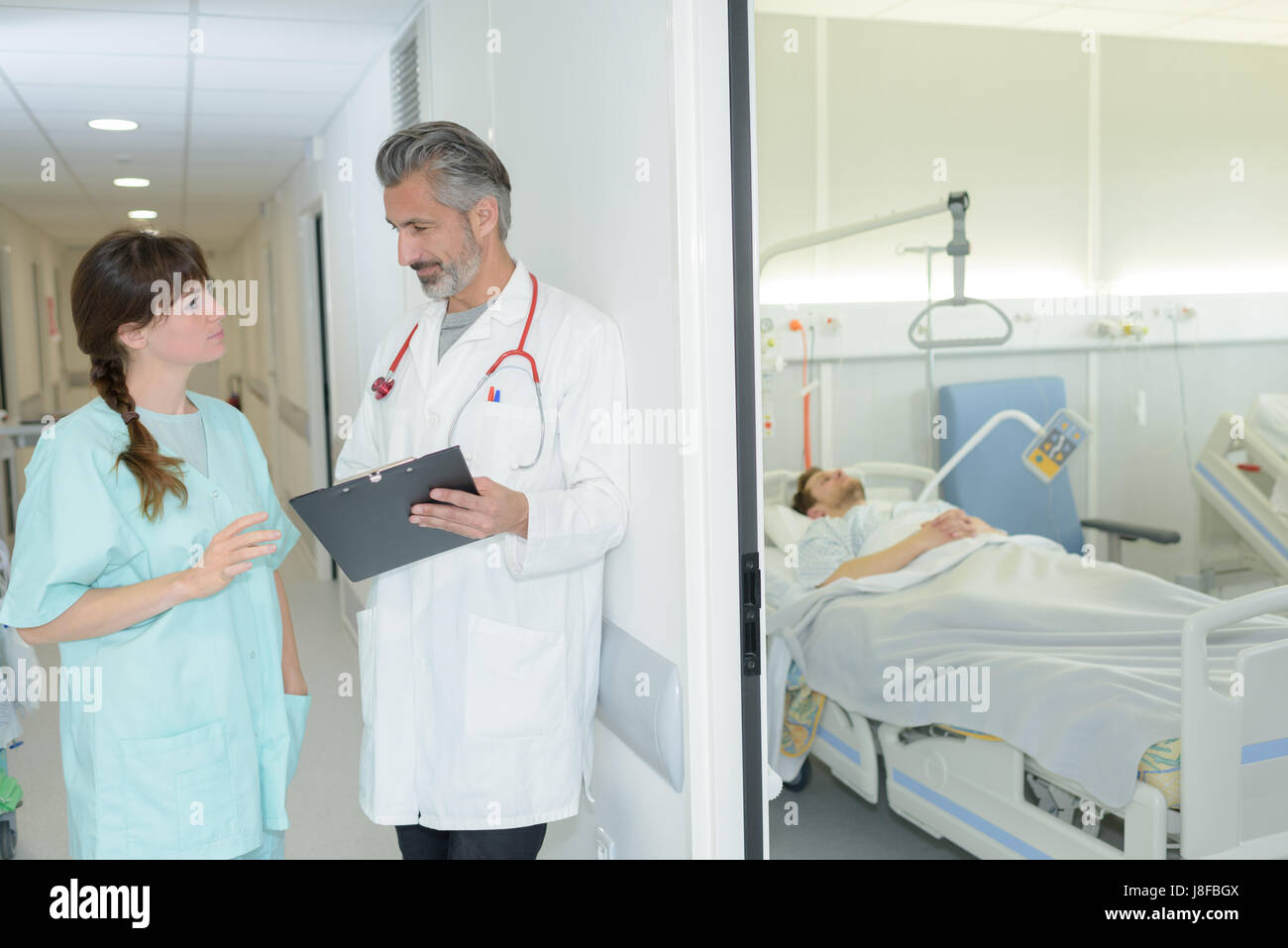 giving instructions to the nurse in charge Stock Photo - Alamy
