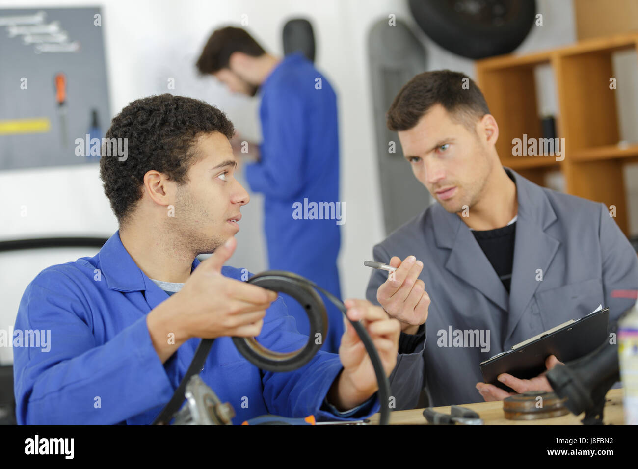 apprentice learns skills Stock Photo - Alamy