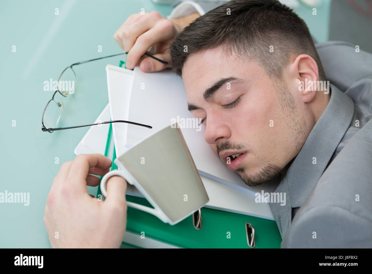 overworking or studying Stock Photo - Alamy
