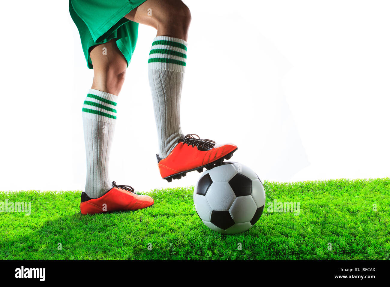 legs of football player ,soccer player and soccer ball isolated white ...