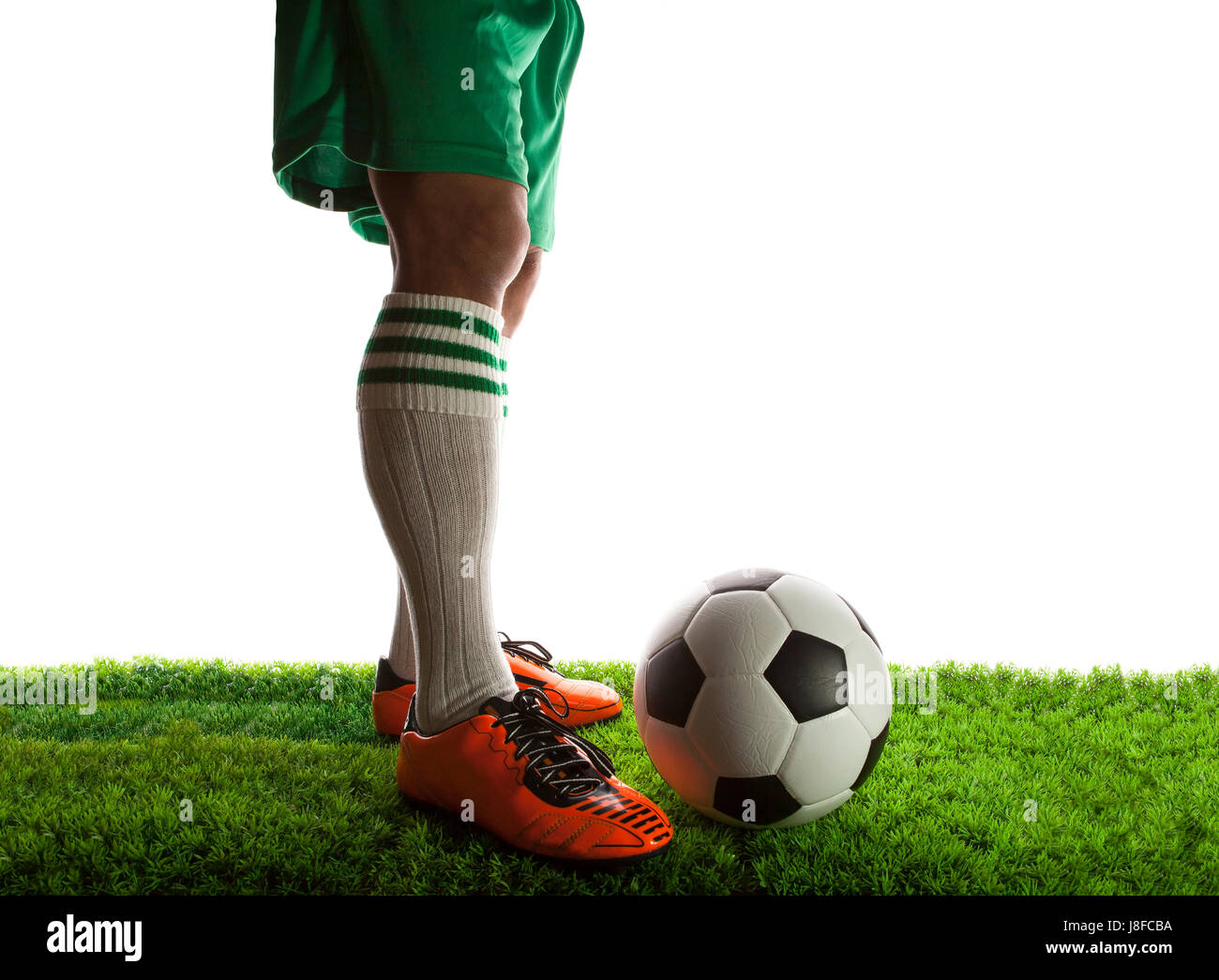 legs of football player ,soccer player and soccer ball isolated white ...