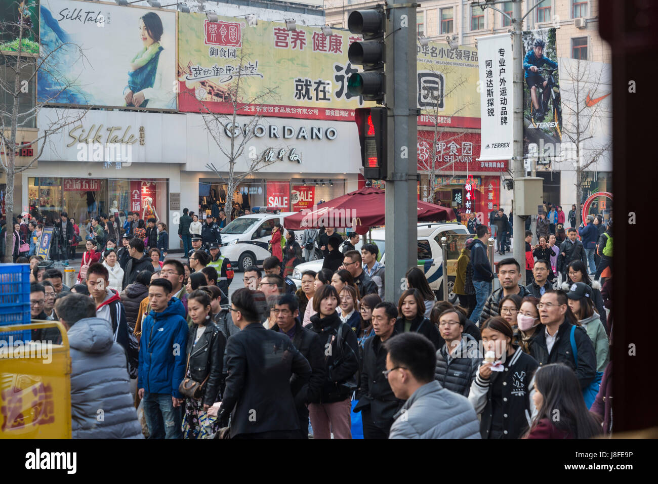 Street scene with crowds of people in central Beijing, China Stock ...