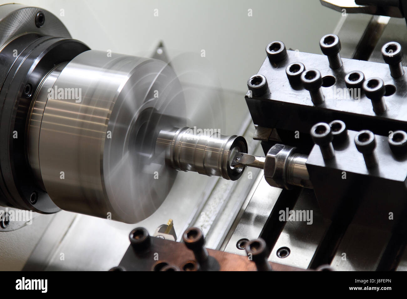 Rotating the Chuck of the cutting machine Stock Photo - Alamy