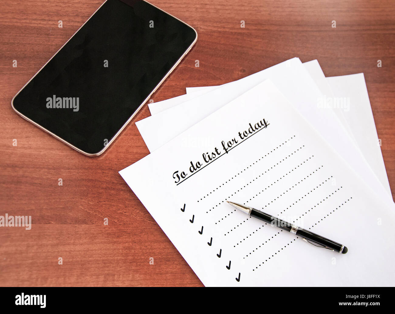 blank checklist on wooden table Stock Photo - Alamy