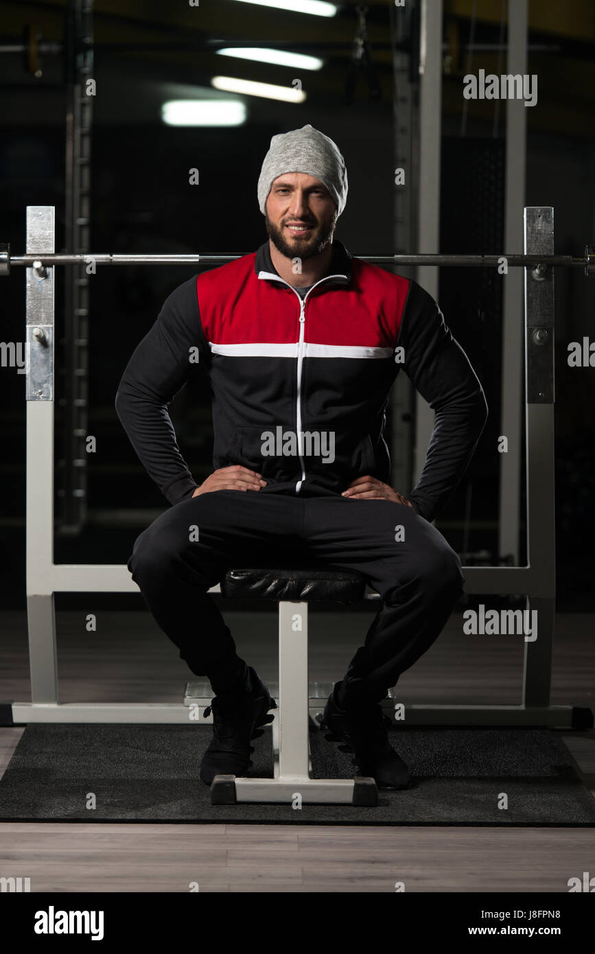 Portrait Of A Physically Fit Man In Track Suit Resting His Well Trained ...