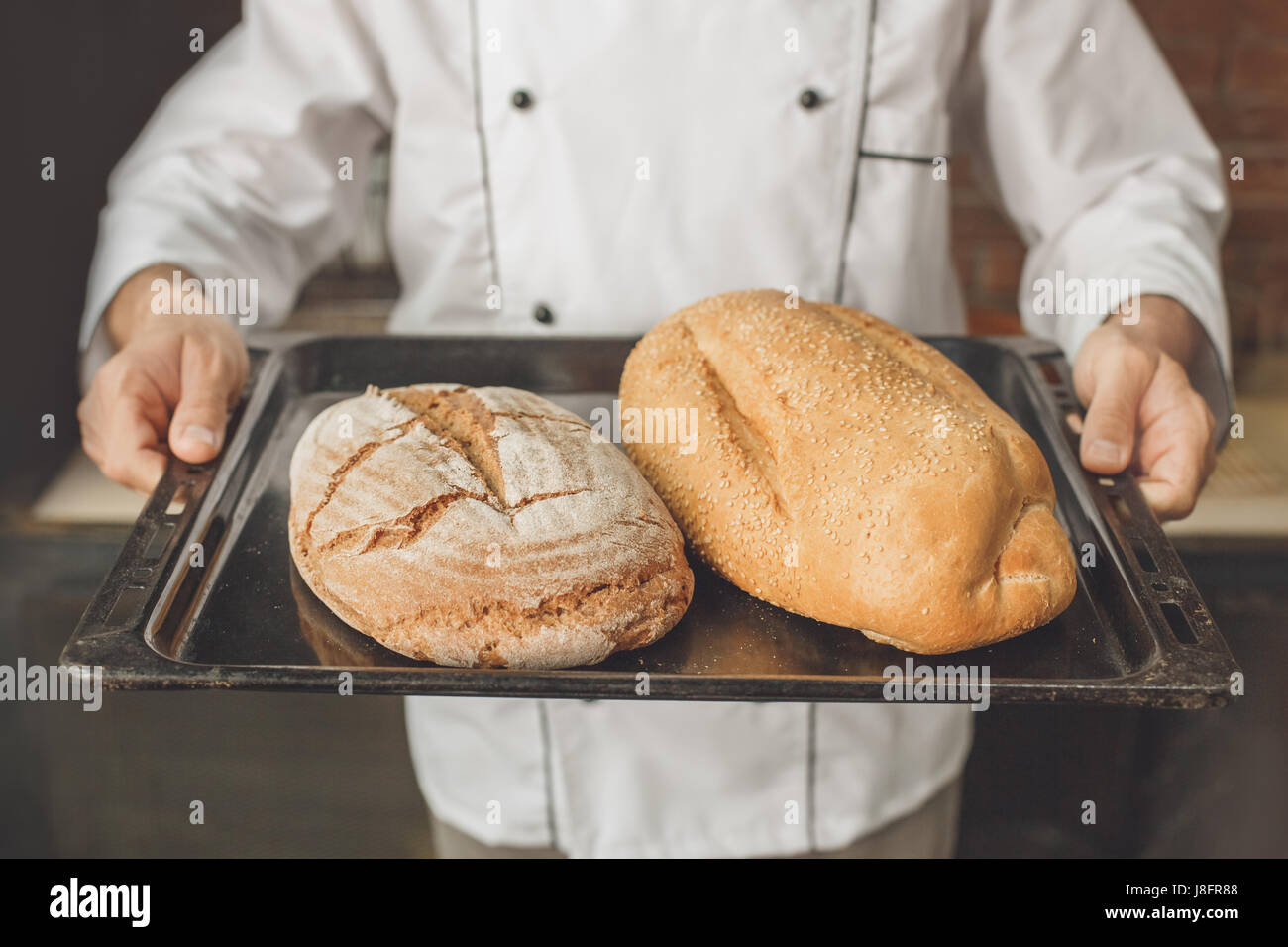 Bakery chef cooking bake in the kitchen professional Stock Photo - Alamy