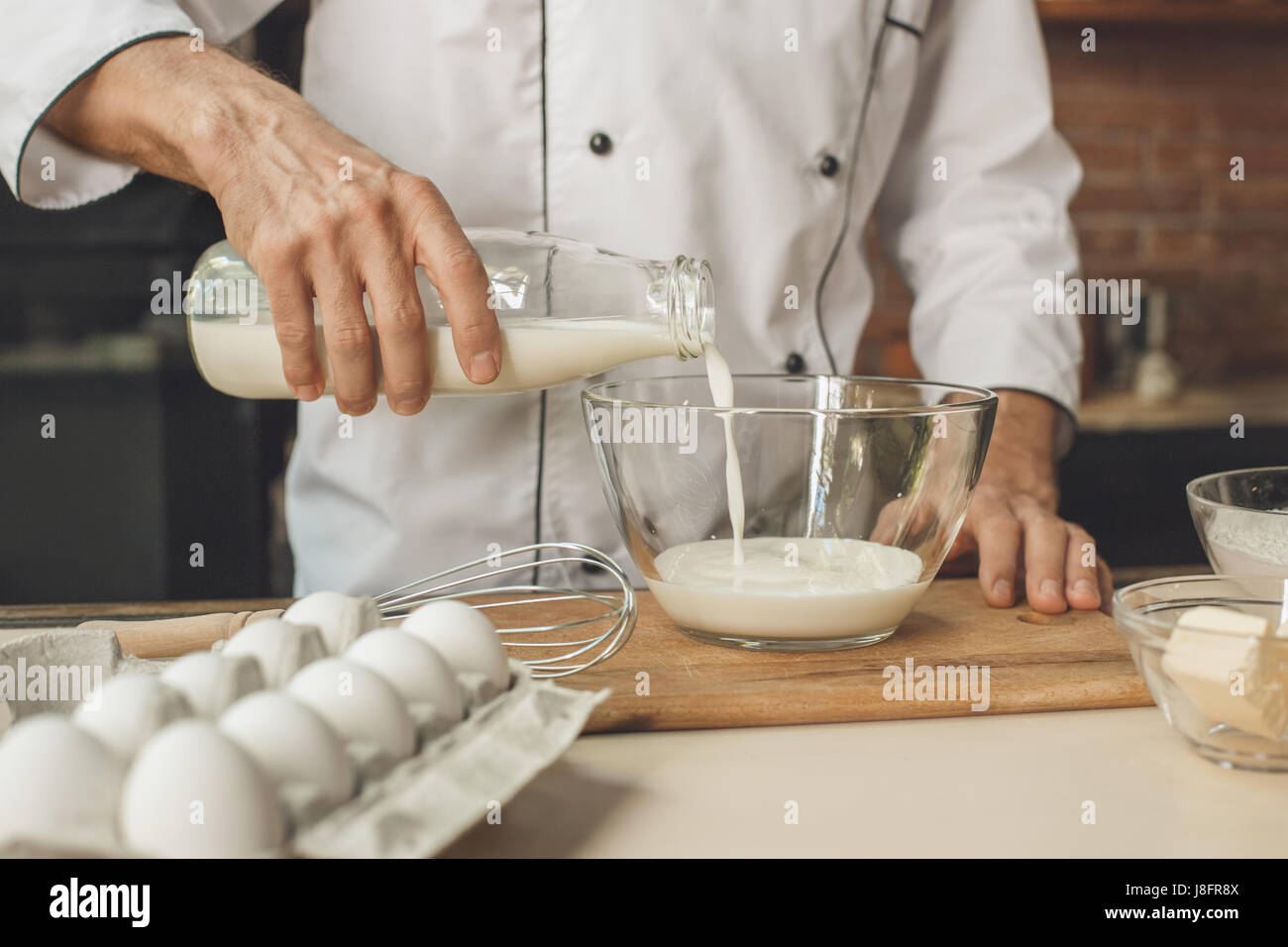 Bakery chef cooking bake in the kitchen professional Stock Photo - Alamy