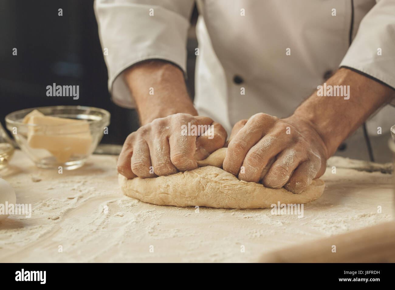Bakery chef cooking bake in the kitchen professional Stock Photo - Alamy