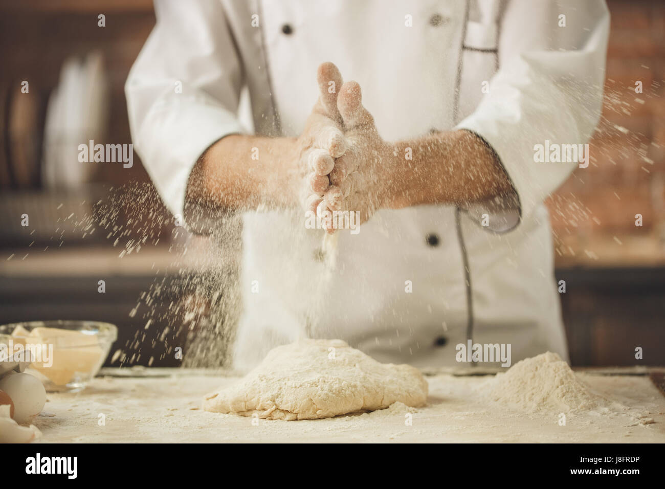 Bakery chef cooking bake in the kitchen professional Stock Photo - Alamy