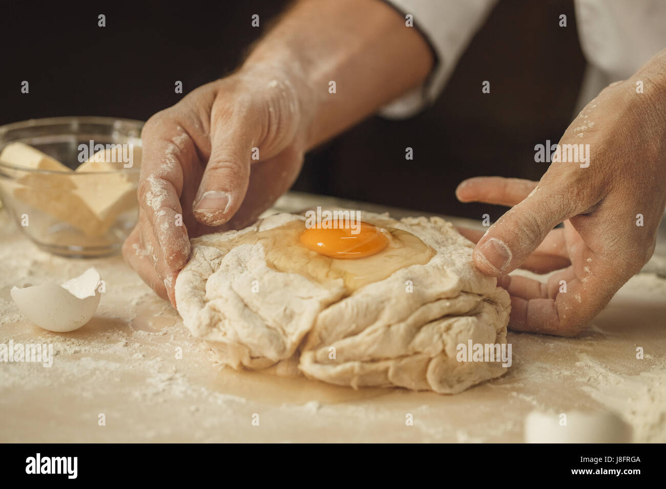 Bakery chef cooking bake in the kitchen professional Stock Photo - Alamy