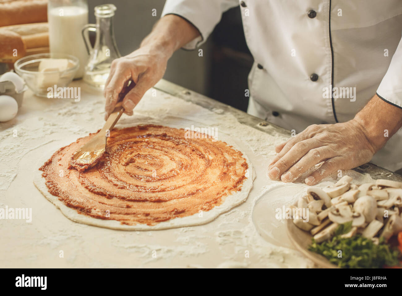 Bakery chef cooking bake in the kitchen professional Stock Photo - Alamy