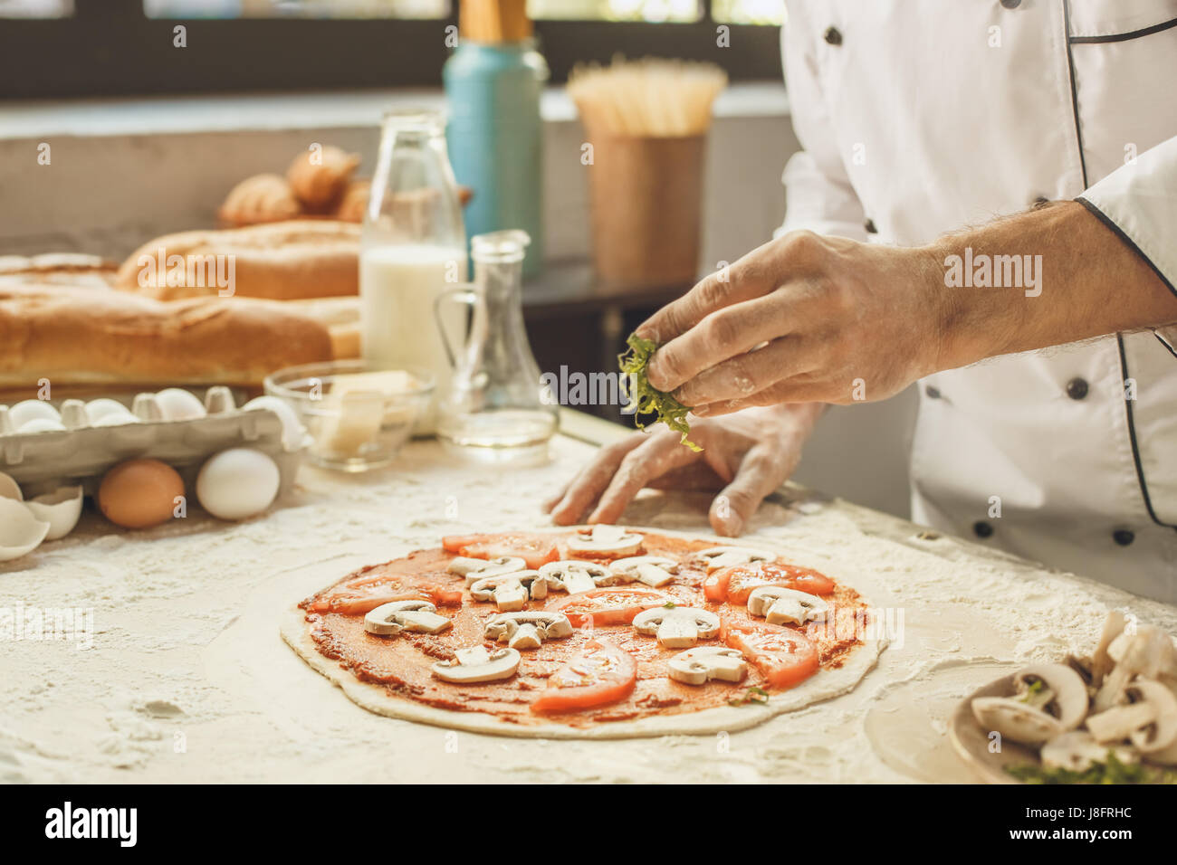 Bakery chef cooking bake in the kitchen professional Stock Photo - Alamy