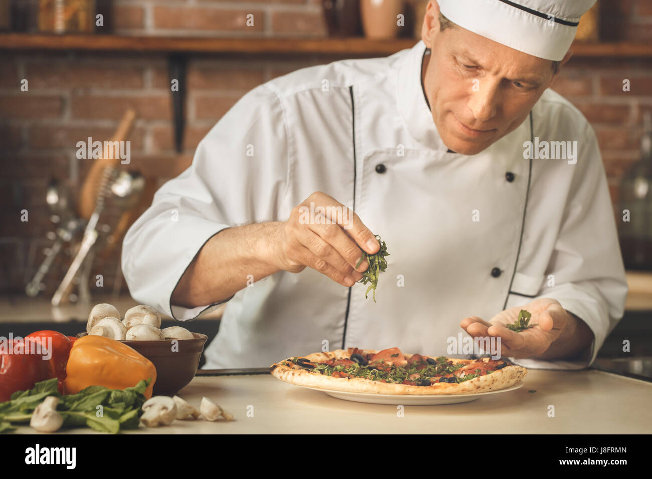 Bakery chef cooking bake in the kitchen professional Stock Photo - Alamy