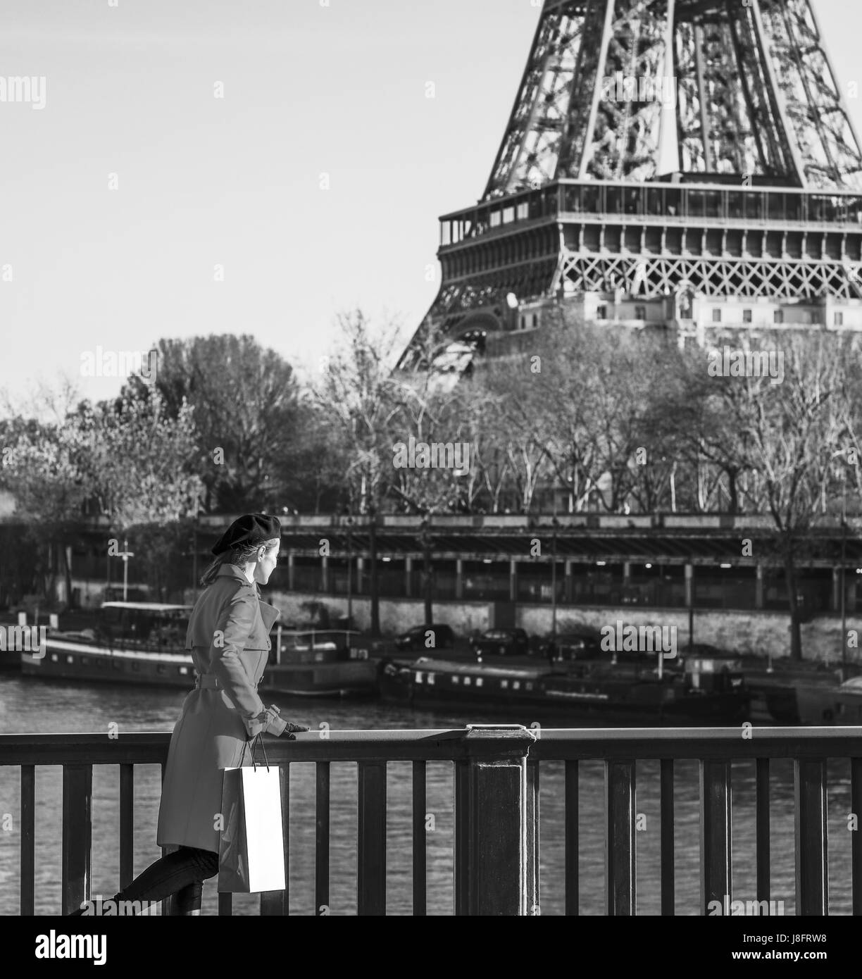 Bright in Paris. Full length portrait of modern woman in red trench ...