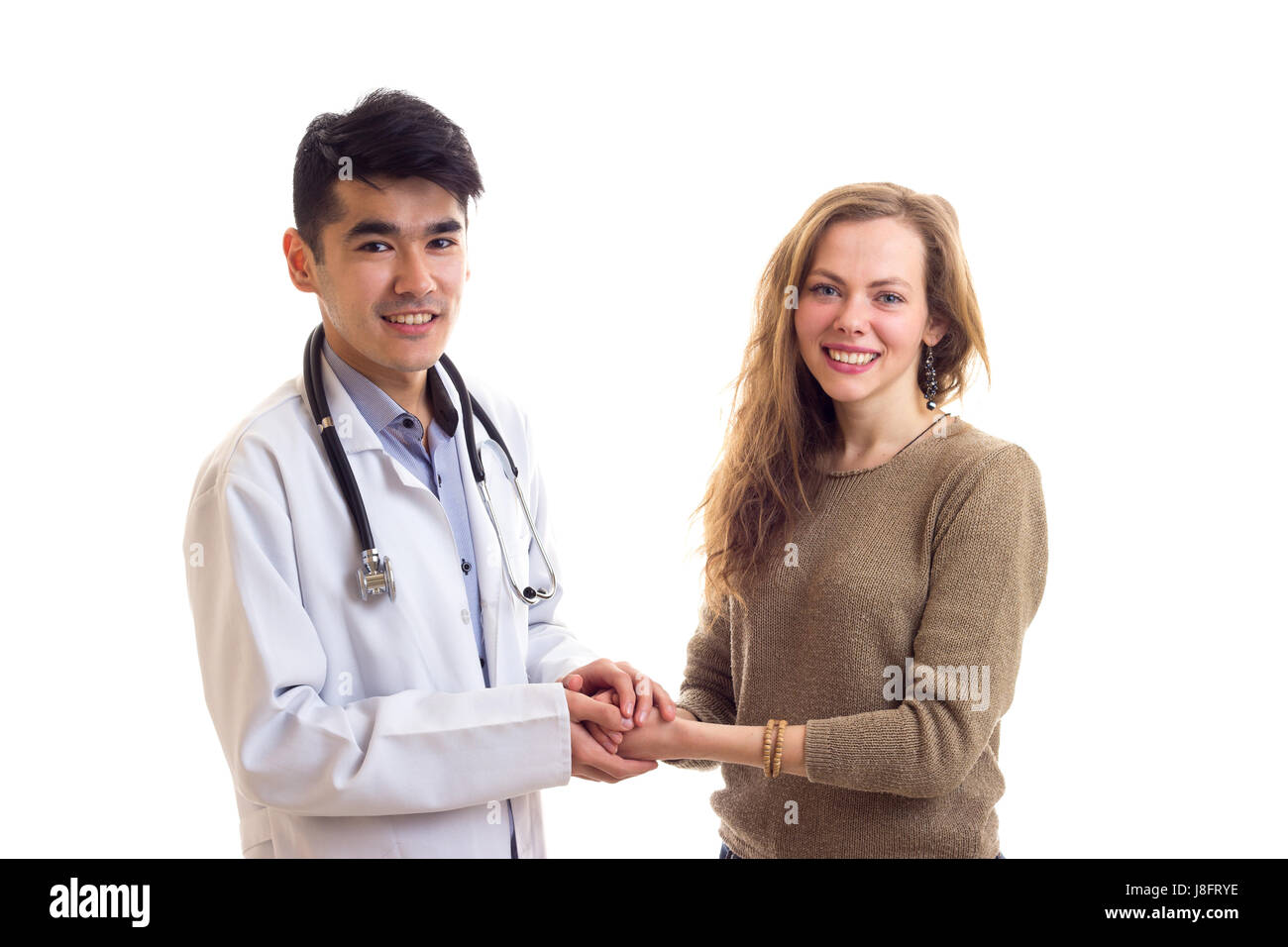 Smiling doctor holding in Cut Out Stock Images & Pictures - Alamy