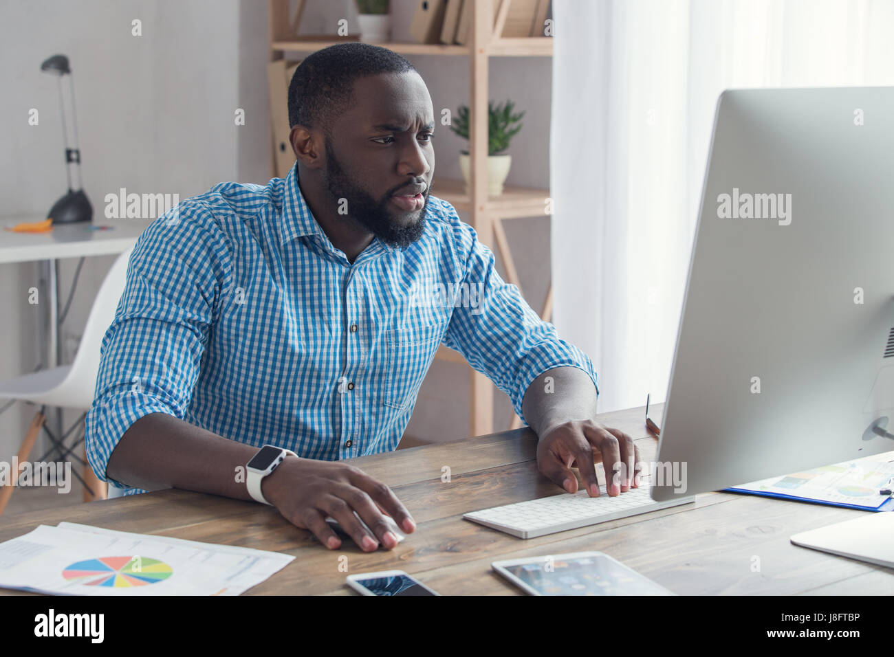 Young african man working in the office business Stock Photo - Alamy