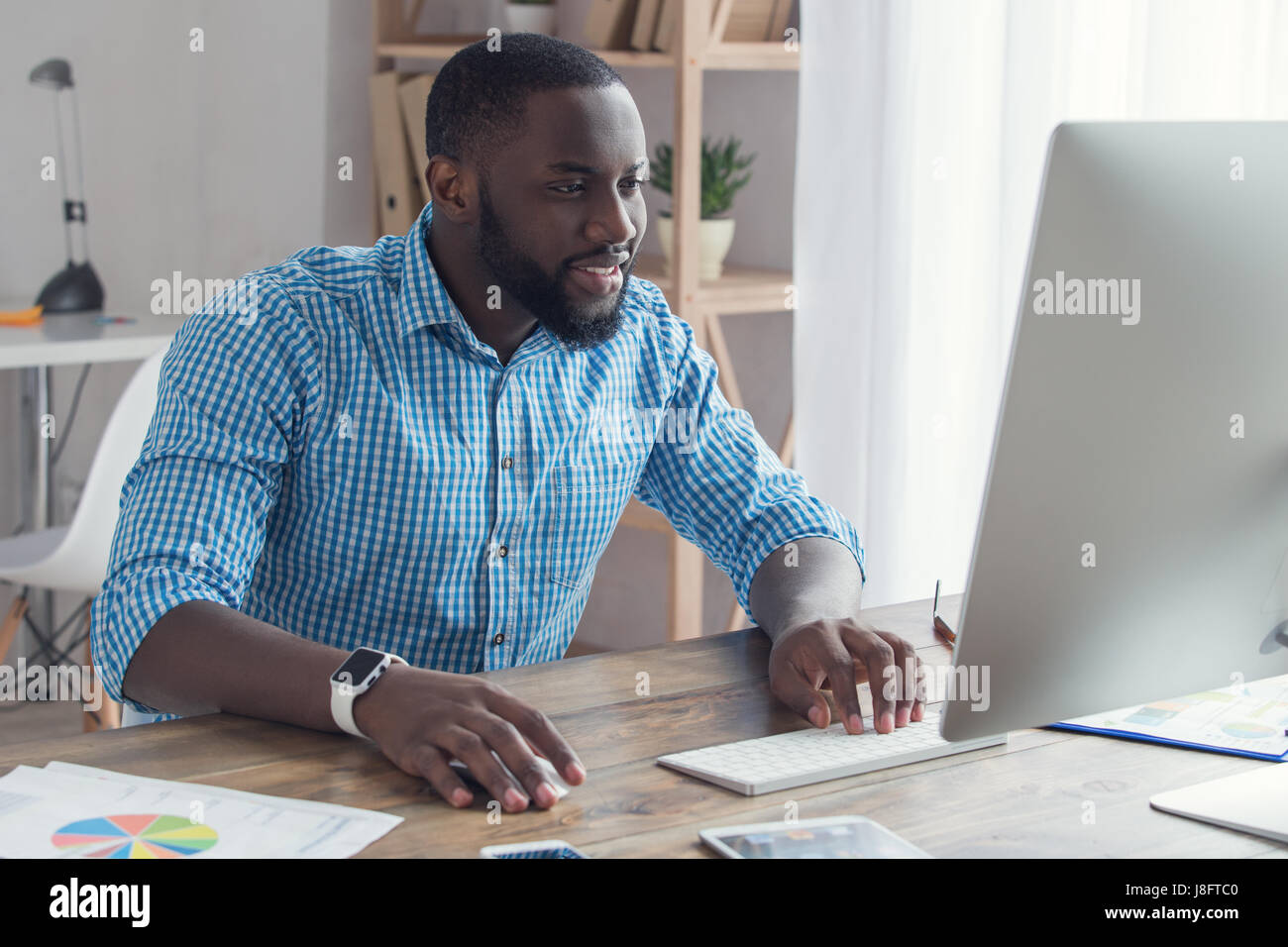Young african man working in the office business Stock Photo - Alamy