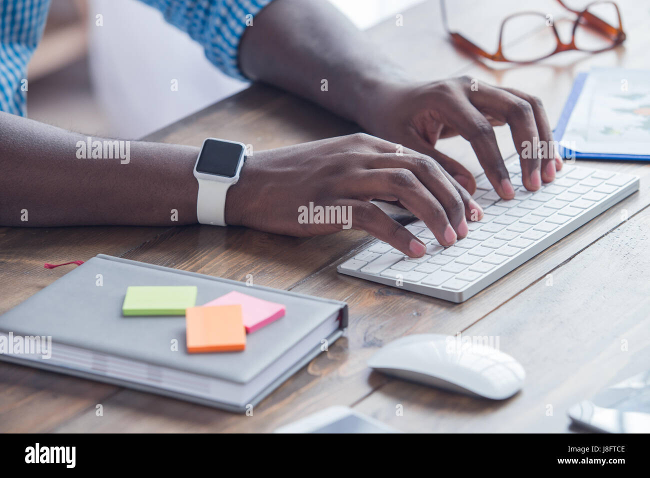 Young african man working in the office business Stock Photo - Alamy