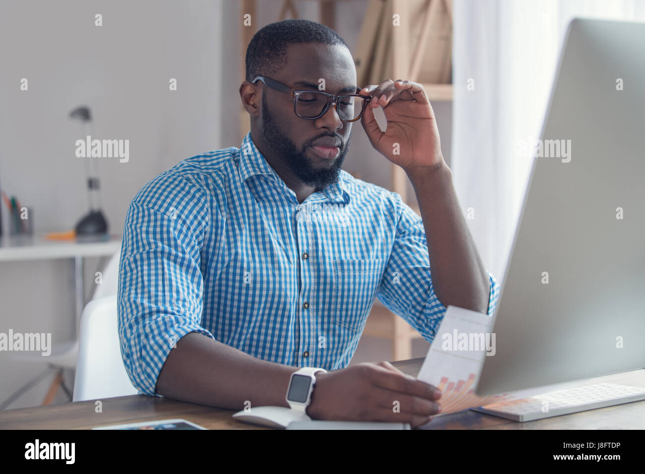 Young african man working in the office business Stock Photo - Alamy