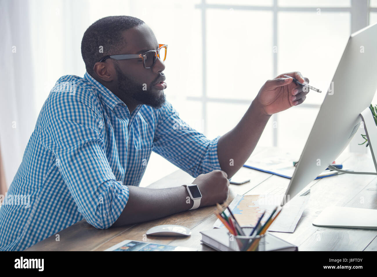 Young african man working in the office business Stock Photo - Alamy
