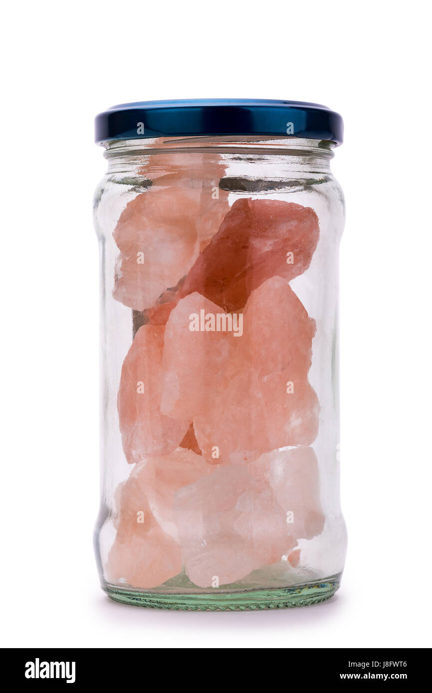 Himalayan pink salt in jar of glass isolated on white background Stock ...