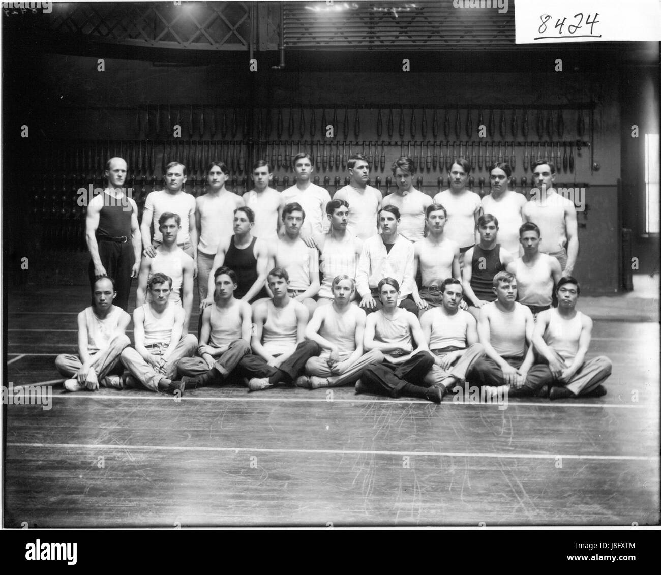 This photograph from 1908 shows a men's physical education class ...