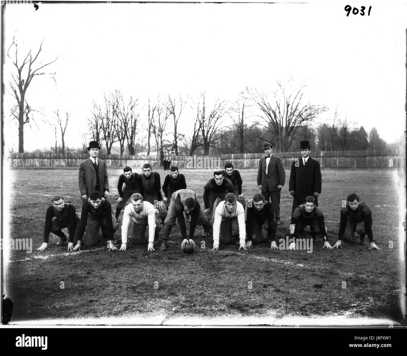 A historical photograph capturing Miami University players and coaches ...