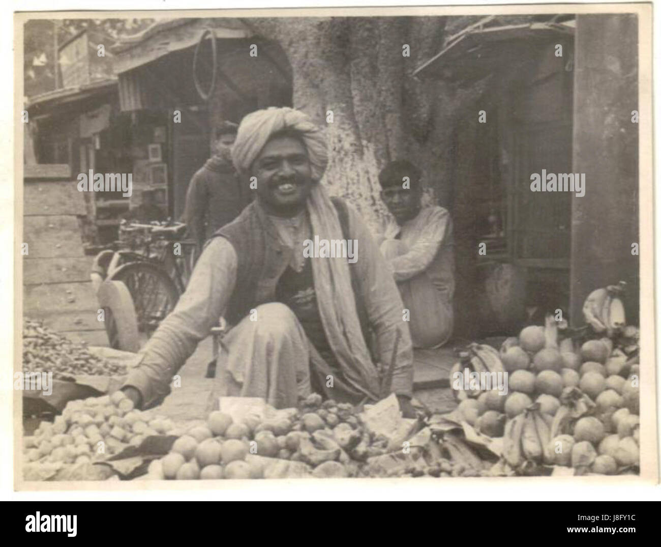The fruit seller of Sadar Bazaar in Ambala, India, circa 1945, offers a ...
