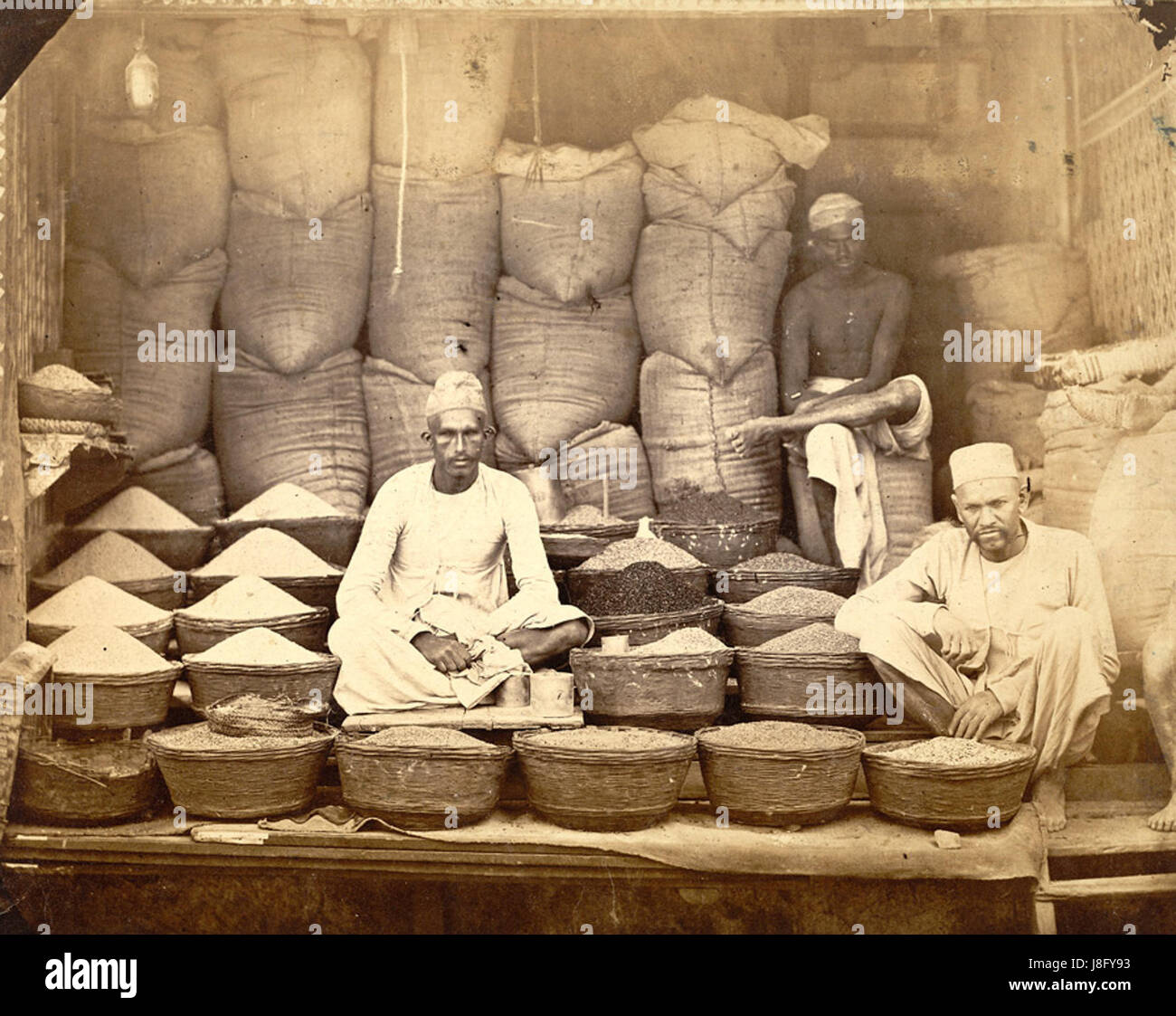 A depiction of a grain seller's shop in Bombay in 1873, reflecting the ...
