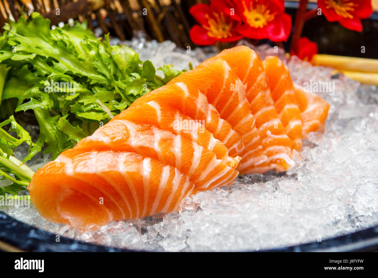 Salmon sashimi on ice Stock Photo - Alamy