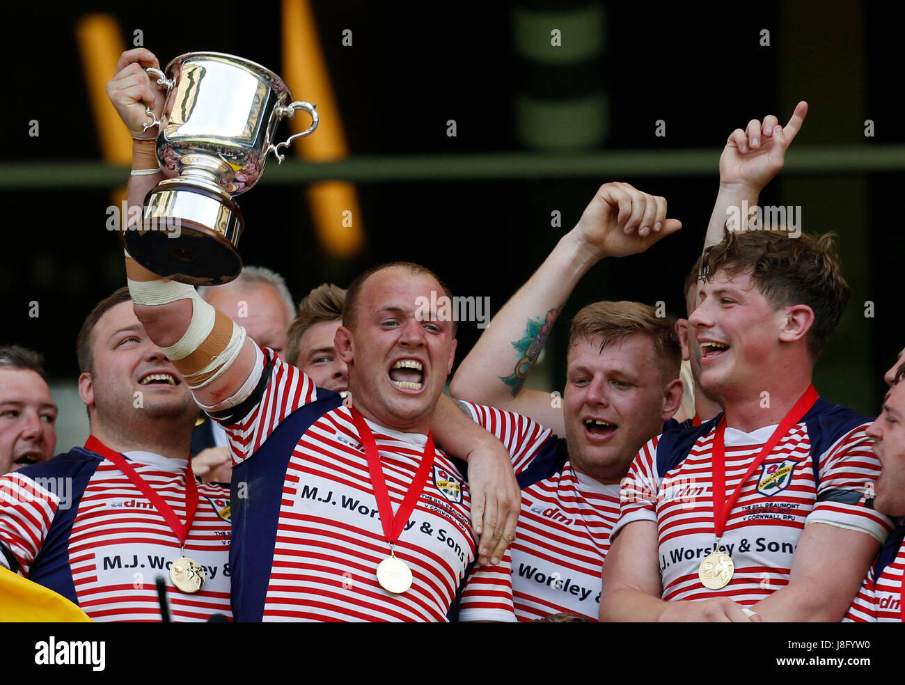 Lancashire's Evan Stewart celebrates with the Trophy during the Bill ...