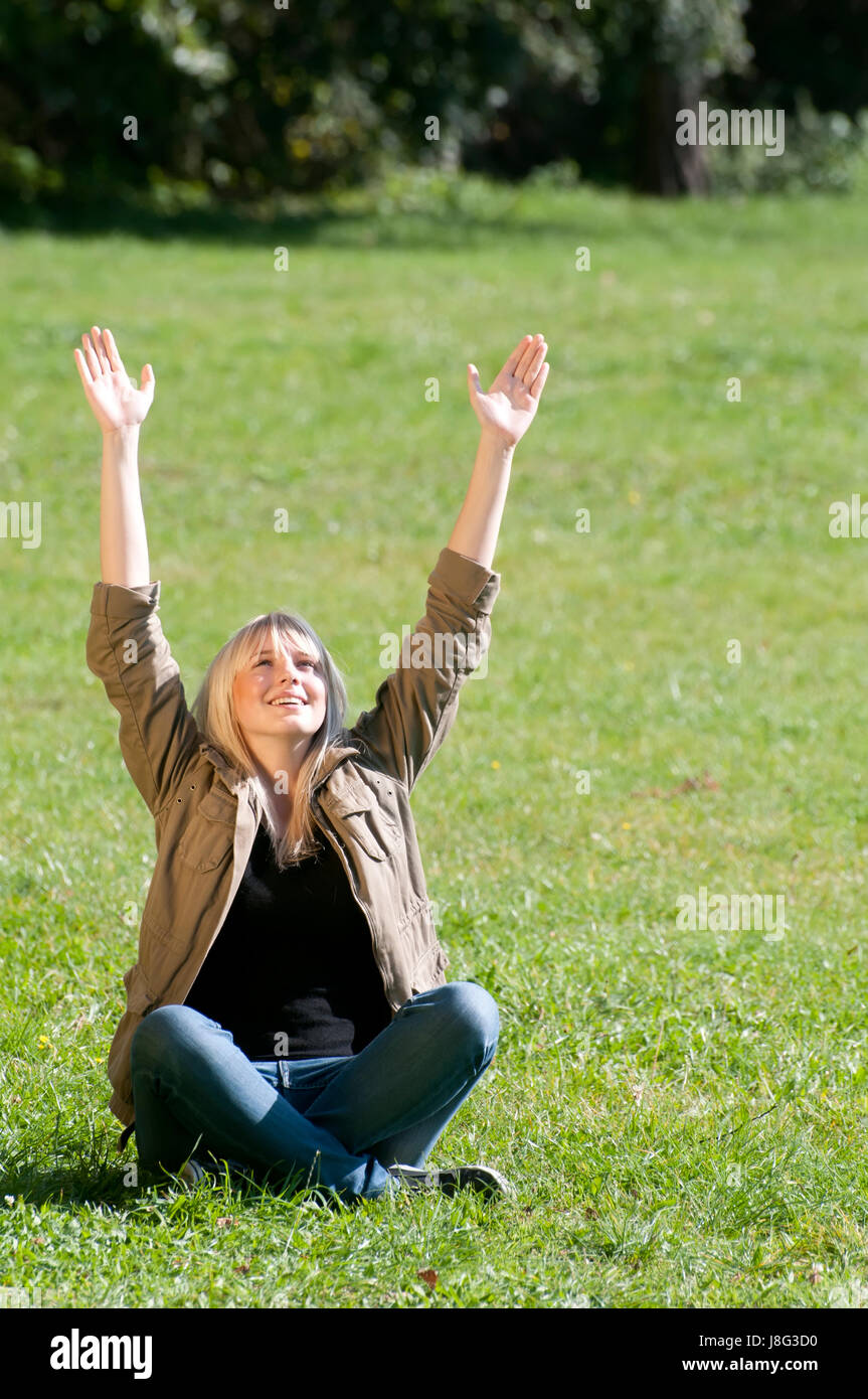 young woman spreads her arms out Stock Photo - Alamy