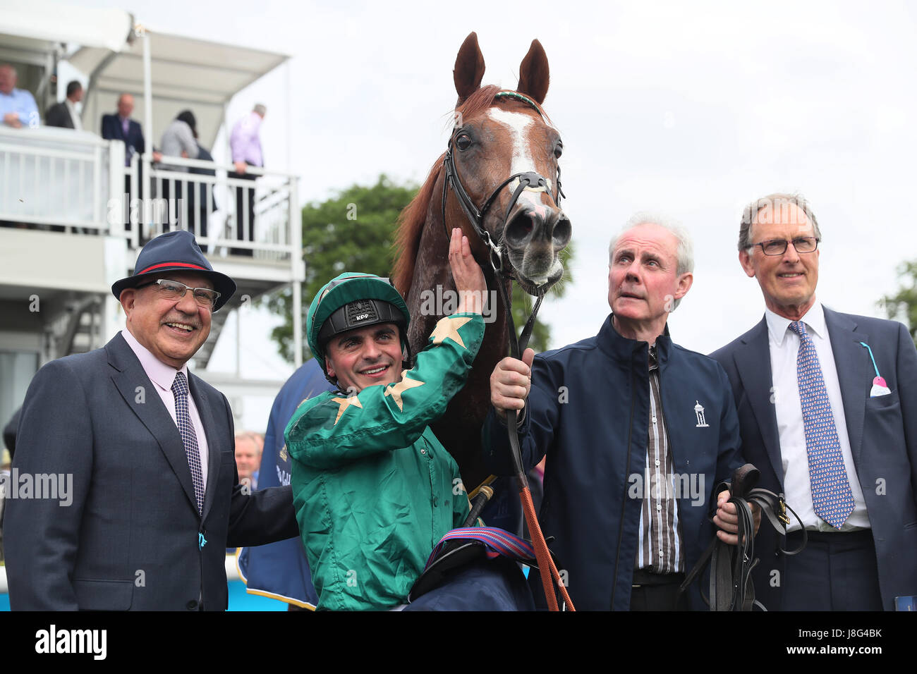 Winning jockey Andrea Atzeni and trainer Roger Charloton (right) with ...