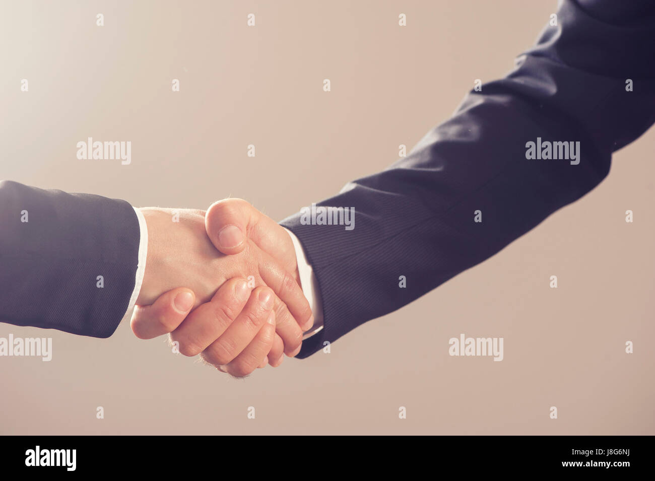 handshake of business partners after signing contract Stock Photo - Alamy