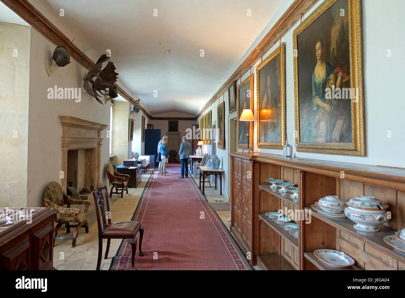 This photograph captures the interior hallway of Lacock Abbey, located ...