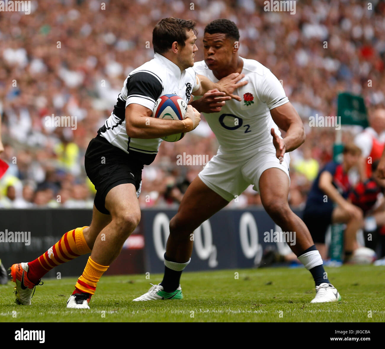 England's Nathan Earle (right) and Barbarians' Alex Goode during the ...