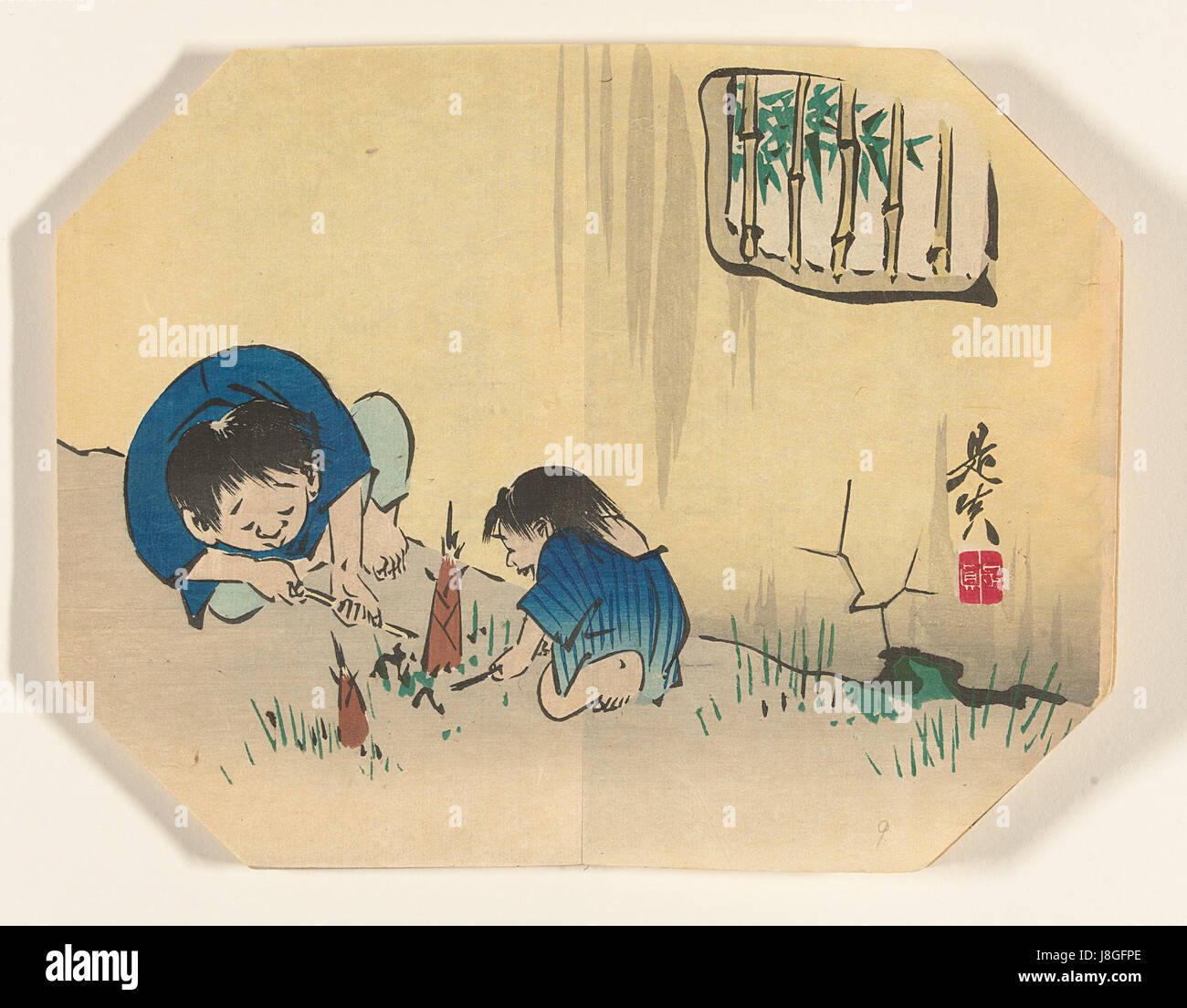 This photograph depicts children excavating bamboo roots, capturing a ...